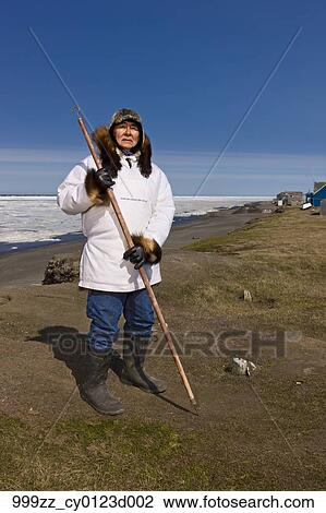 Portrait of a male Inupiaq Eskimo hunter wearing his Eskimo parka ...