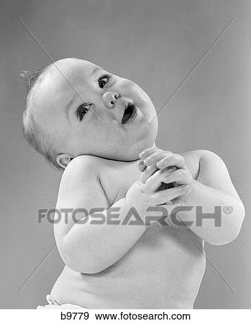 Baby In Diaper Head To One Side Arms Hands Clasped In Front Cute Make ...