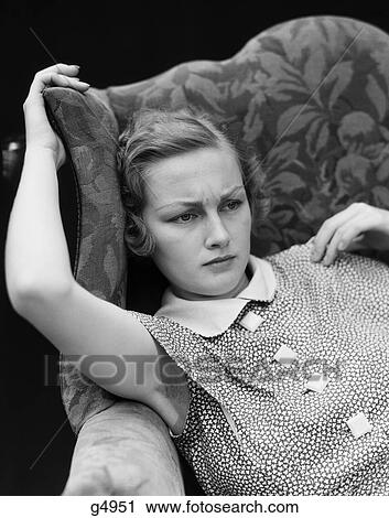 1930S Woman Sitting Slumped Position With A Worried Expression And A ...
