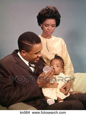 Stock Photo of 1960 1960S African-American Family Father Feeding Baby ...