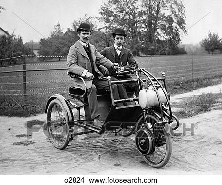 1900S Two Men In Bowler Hats Sitting In Three Wheel Motorized Horseless ...