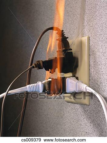 Stock Photograph of 1990S Overloaded Electrical Outlet Bursting Into ...