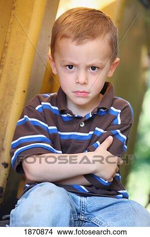 A young boy with a frown on his face Picture | 1870874 | Fotosearch