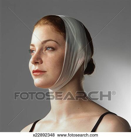 Pictures of close up view of a woman with a bandage wrapped around her ...