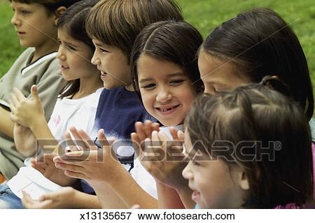 Picture of Six children outside clapping hands, close-up x13135657 ...