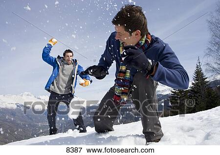 Picture of Two young men having snow fight in snow field 8387 - Search ...