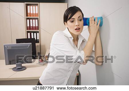 Office worker eavesdropping Stock Image | u21887791 | Fotosearch