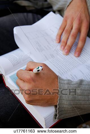 Stock Photo of View of a person writing in a book. u17761163 - Search ...