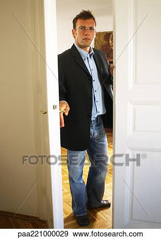 Man opening door Stock Photo | paa221000029 | Fotosearch