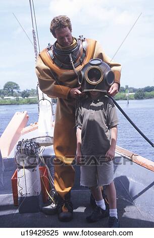 Historic Greek sponge diver in antique diving suit Stock Photography ...
