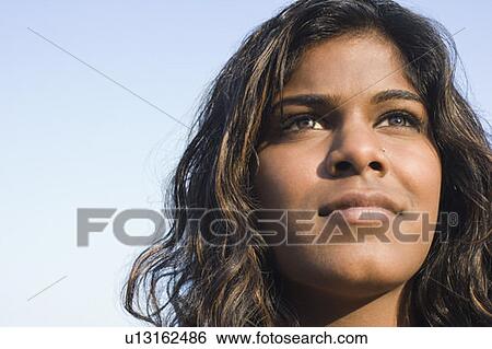 Close-up of a young woman smirking Stock Photograph | u13162486 ...